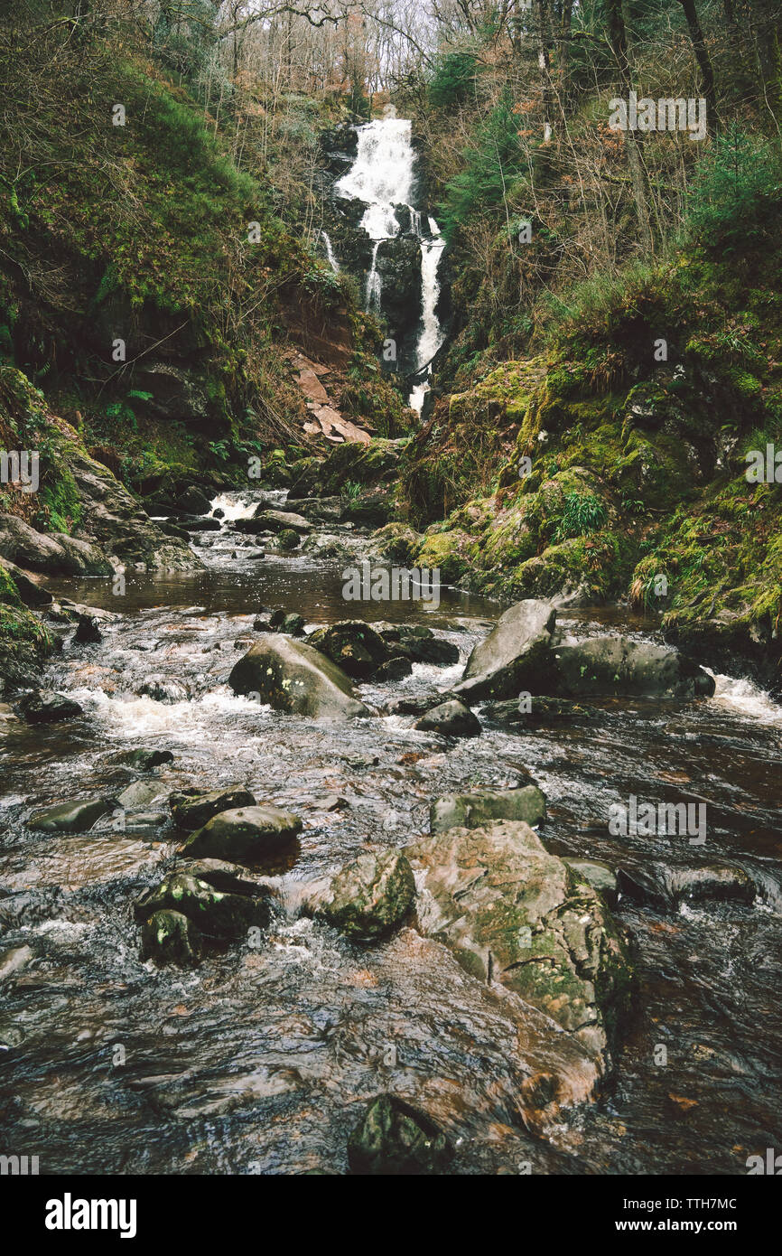 Waterfall above stream Stock Photo - Alamy
