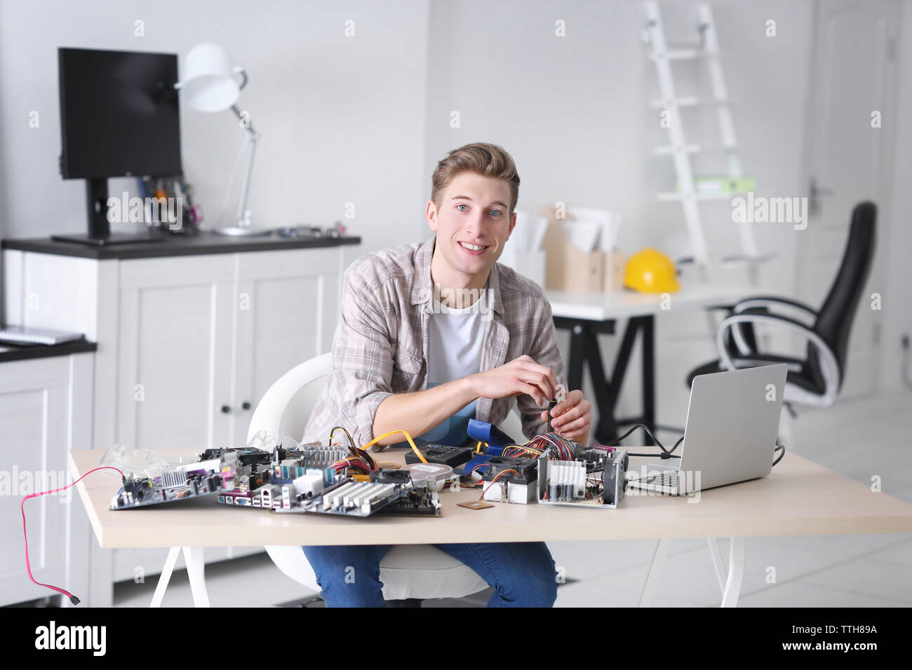Notebook man repairing hi-res stock photography and images - Alamy