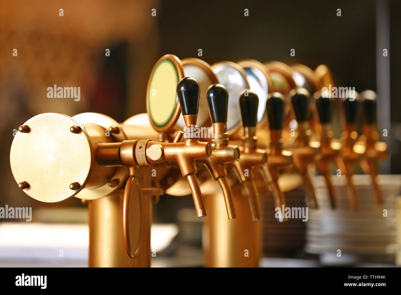 Draught beer taps in a bar Stock Photo - Alamy