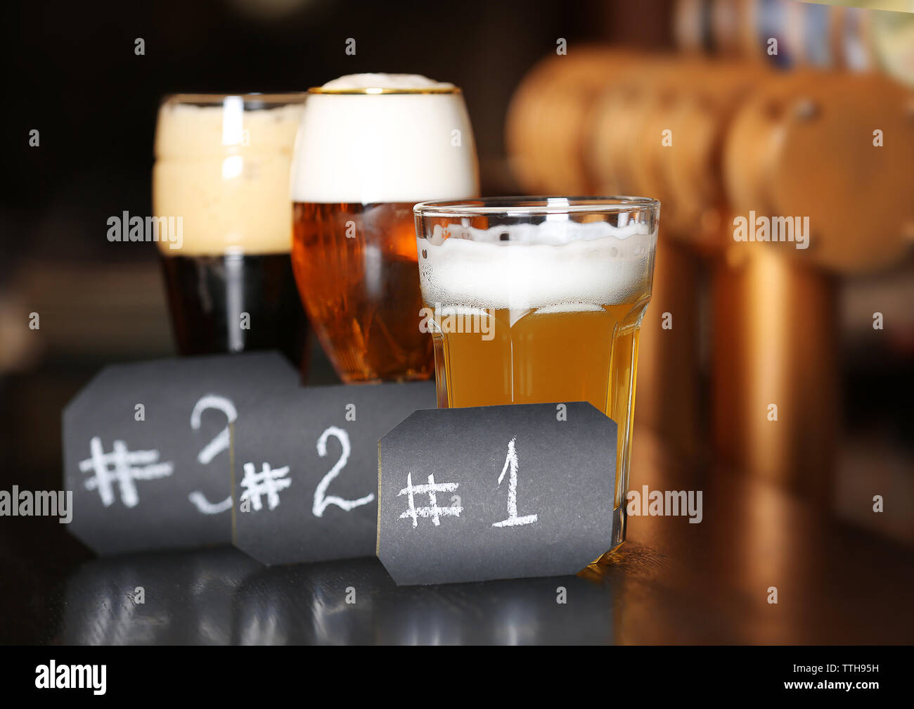 Three sampling glasses of beer in a bar Stock Photo - Alamy