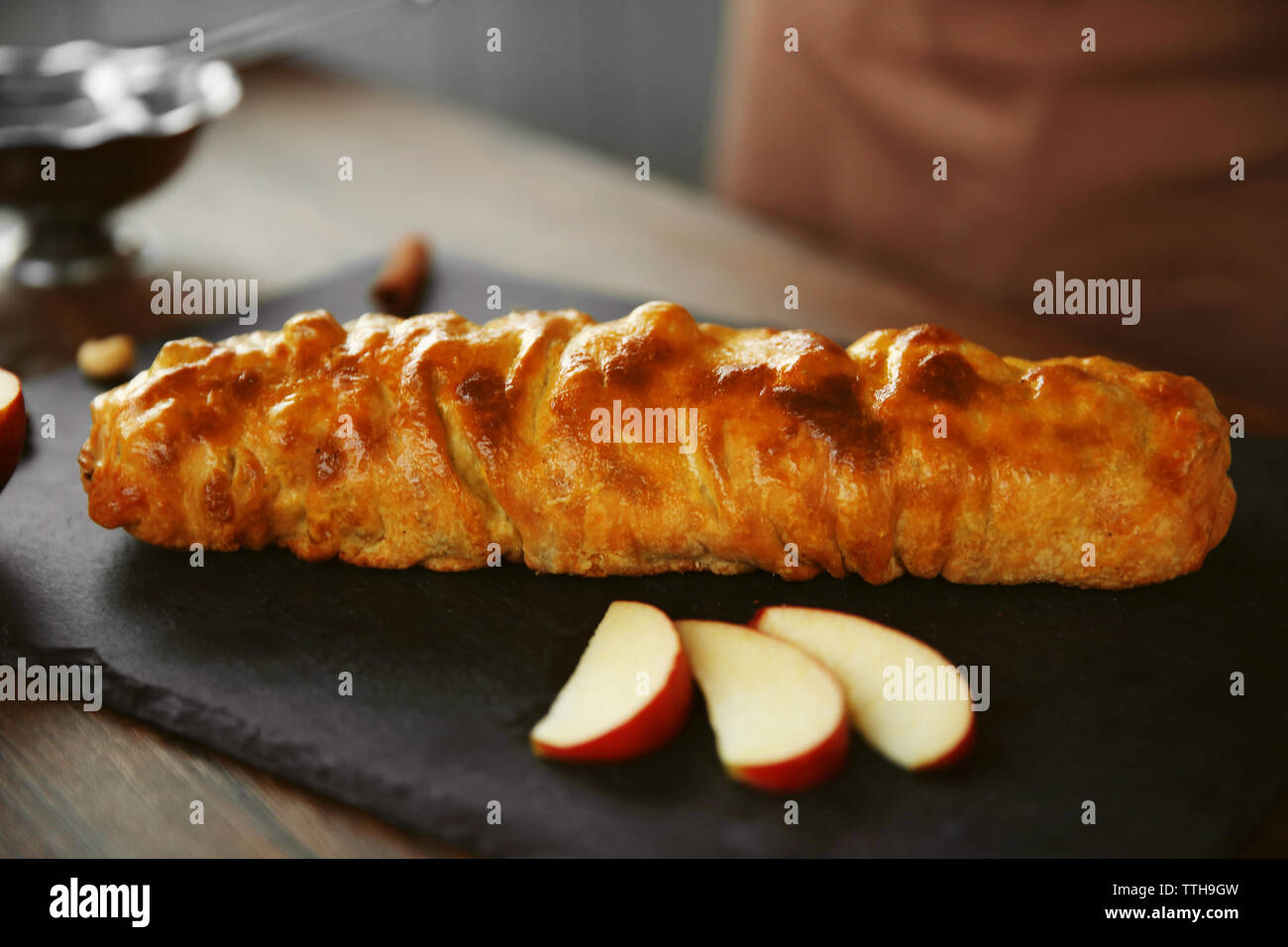 Baked apple roll on a slate plate Stock Photo - Alamy