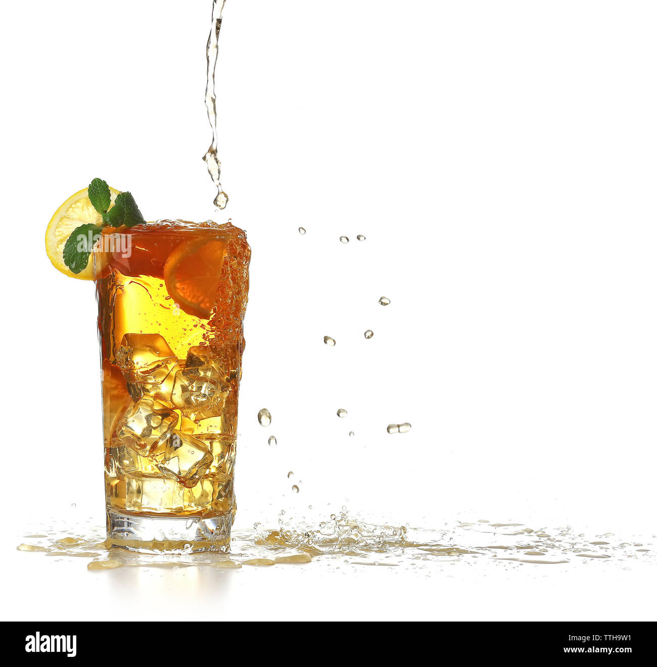 Fresh iced tea pouring in a glass Stock Photo - Alamy
