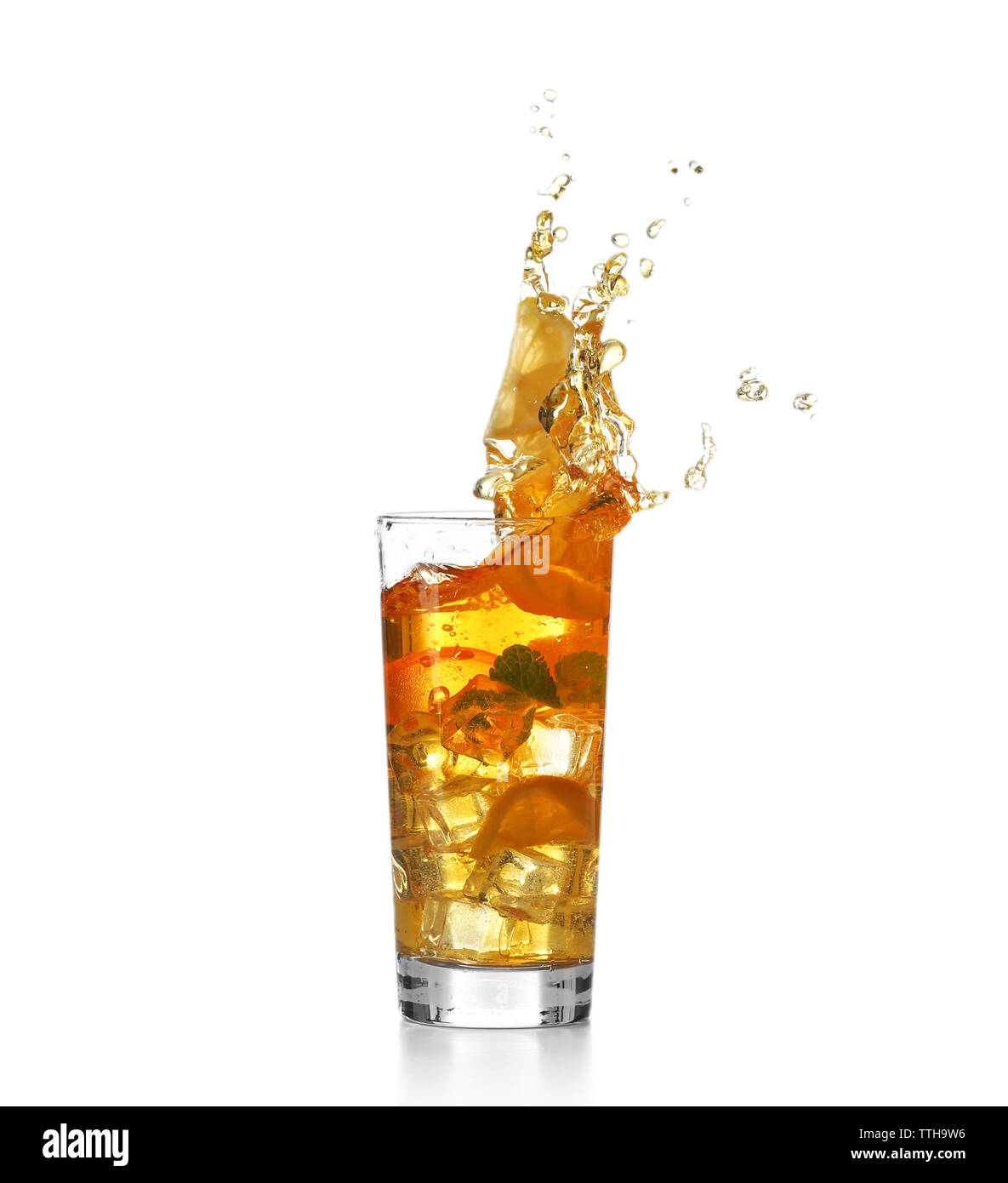 Fresh iced tea splashing in glass Stock Photo - Alamy