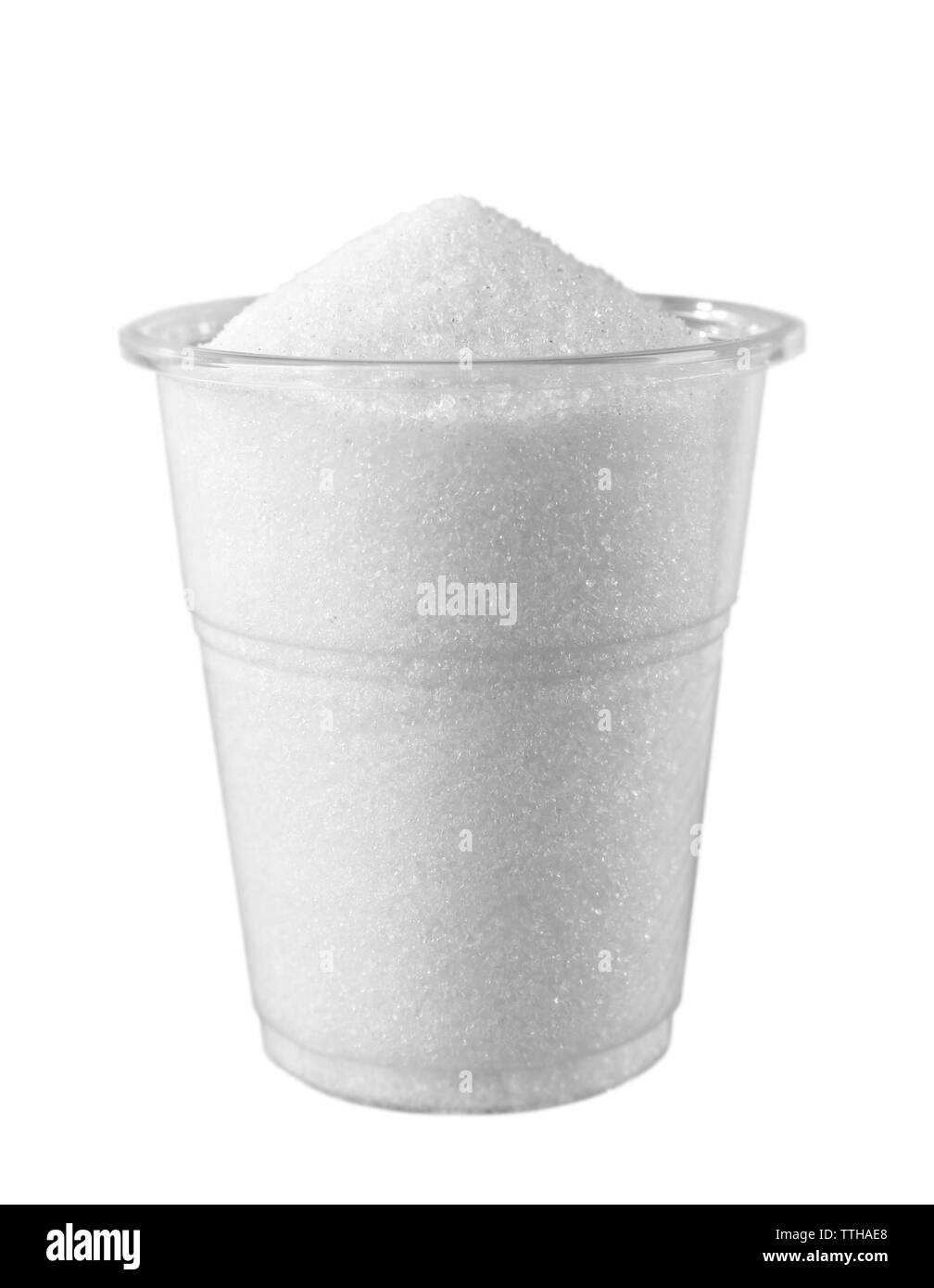 Plastic glass full of sugar on grey background Stock Photo - Alamy
