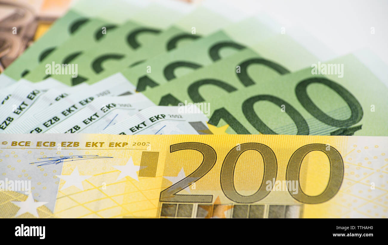 Euros bills of different values. A euro bill of two hundred. Cash money background. Real ...