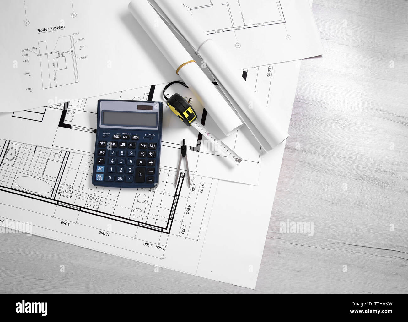 Project drawings and calculator, top view Stock Photo - Alamy