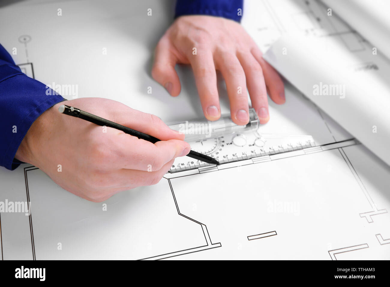 Male hands drawing line on a blueprint Stock Photo - Alamy