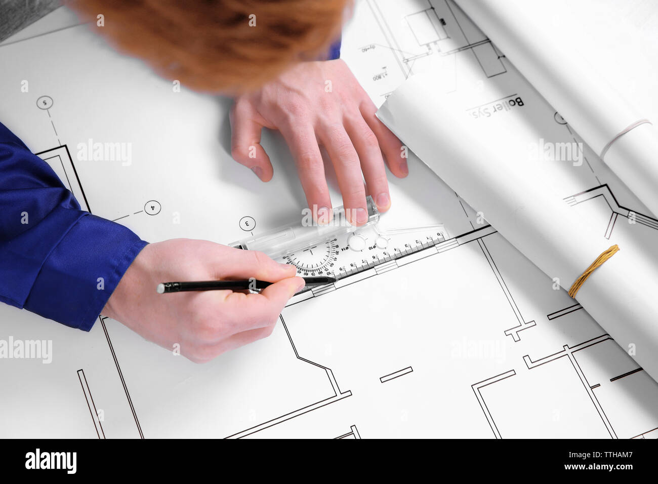Male hands drawing line on a blueprint Stock Photo - Alamy