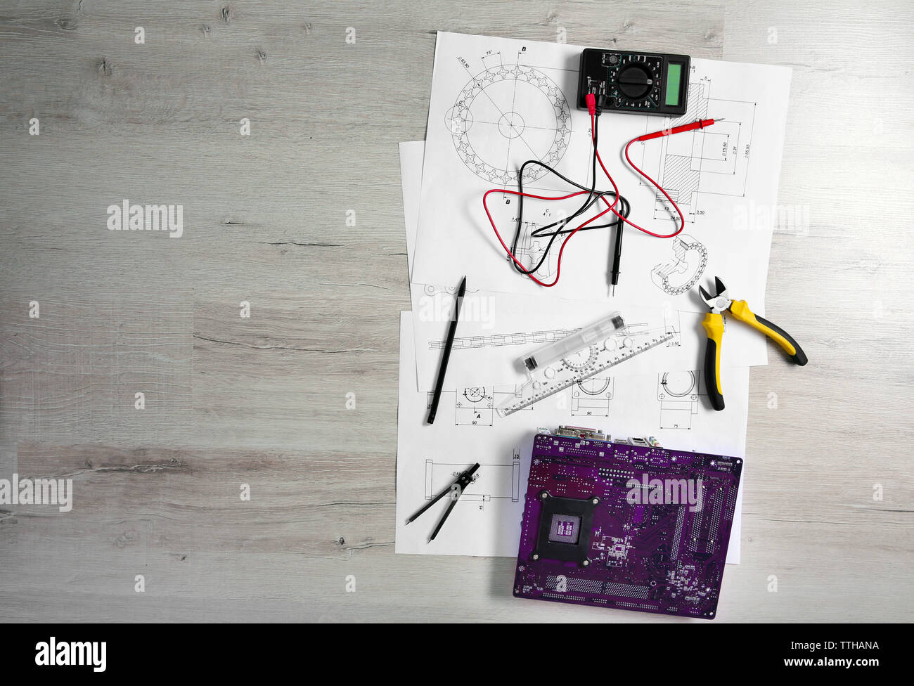 Project drawing and digital multimeter top view Stock Photo - Alamy