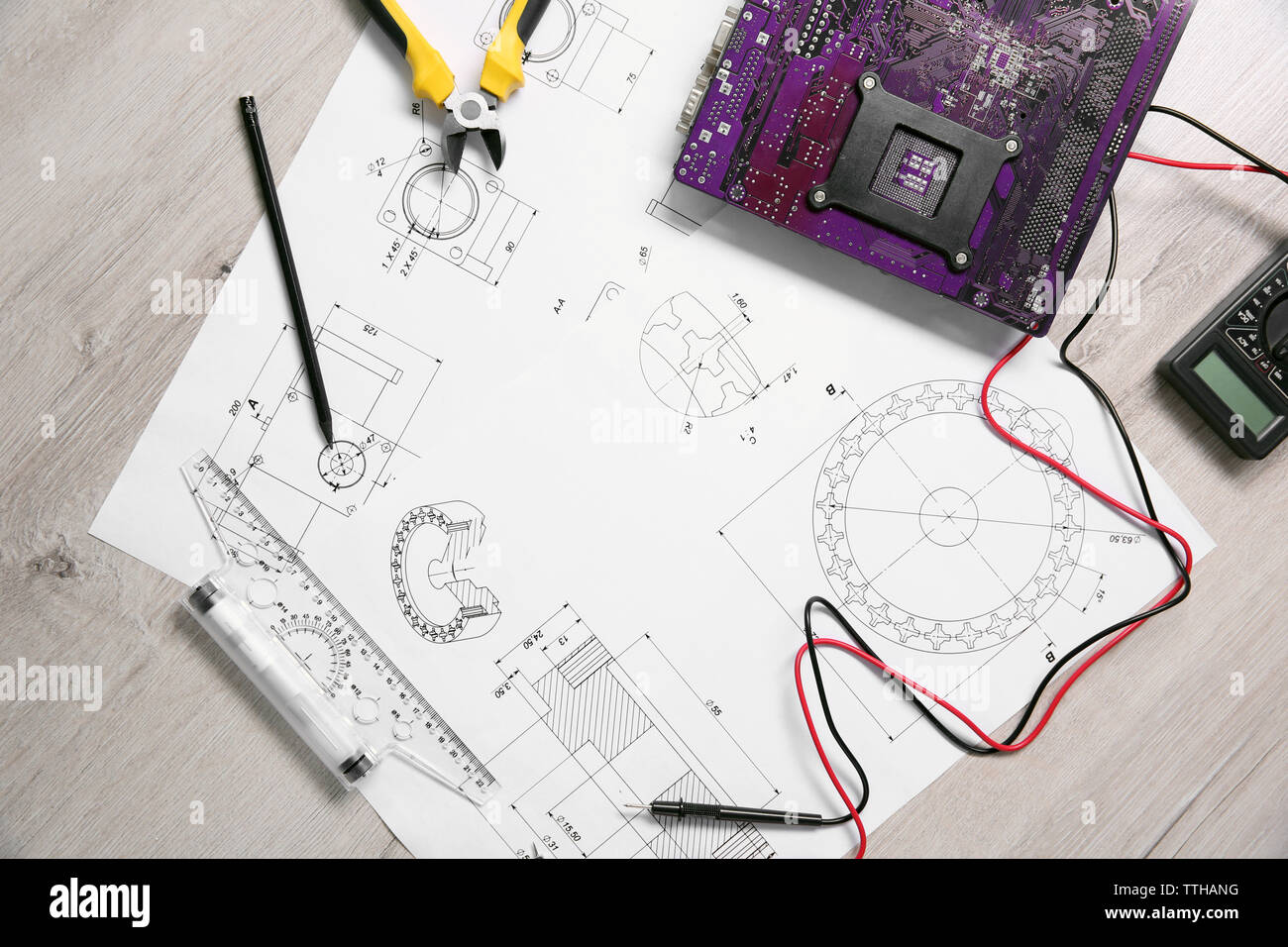 Project drawing and digital multimeter top view Stock Photo - Alamy