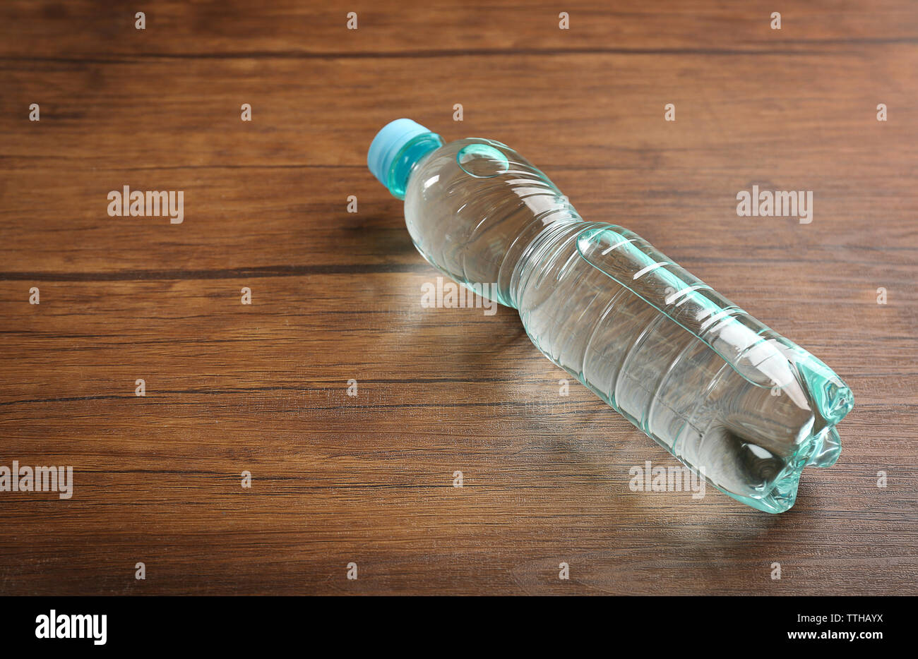Bottled water on the wooden table Stock Photo - Alamy
