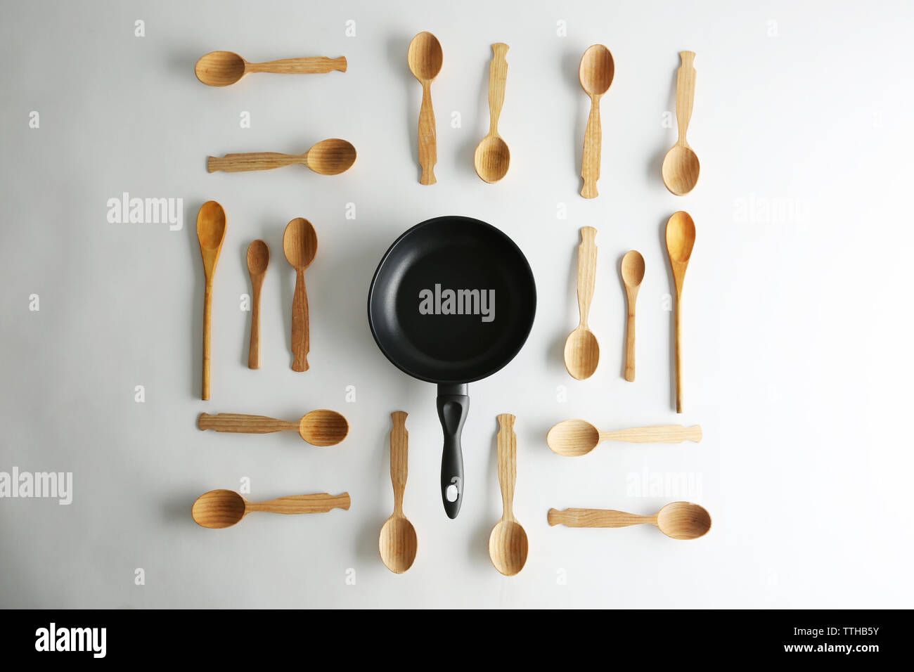 Pan and wooden spoons, top view Stock Photo - Alamy
