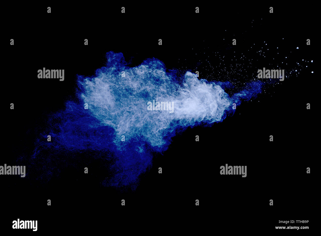 Cloud of powder on dark blue background Stock Photo - Alamy