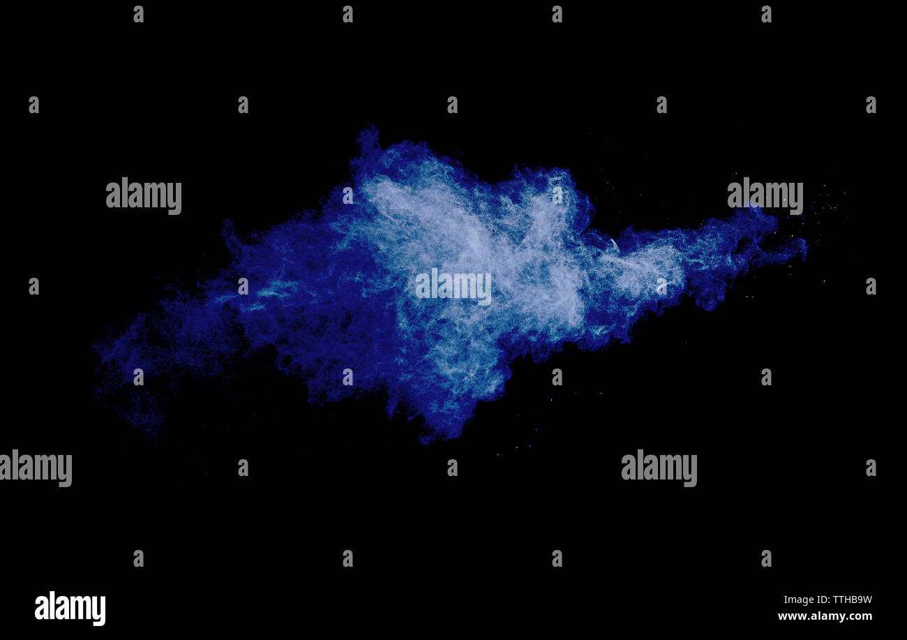 Cloud of powder on dark blue background Stock Photo - Alamy