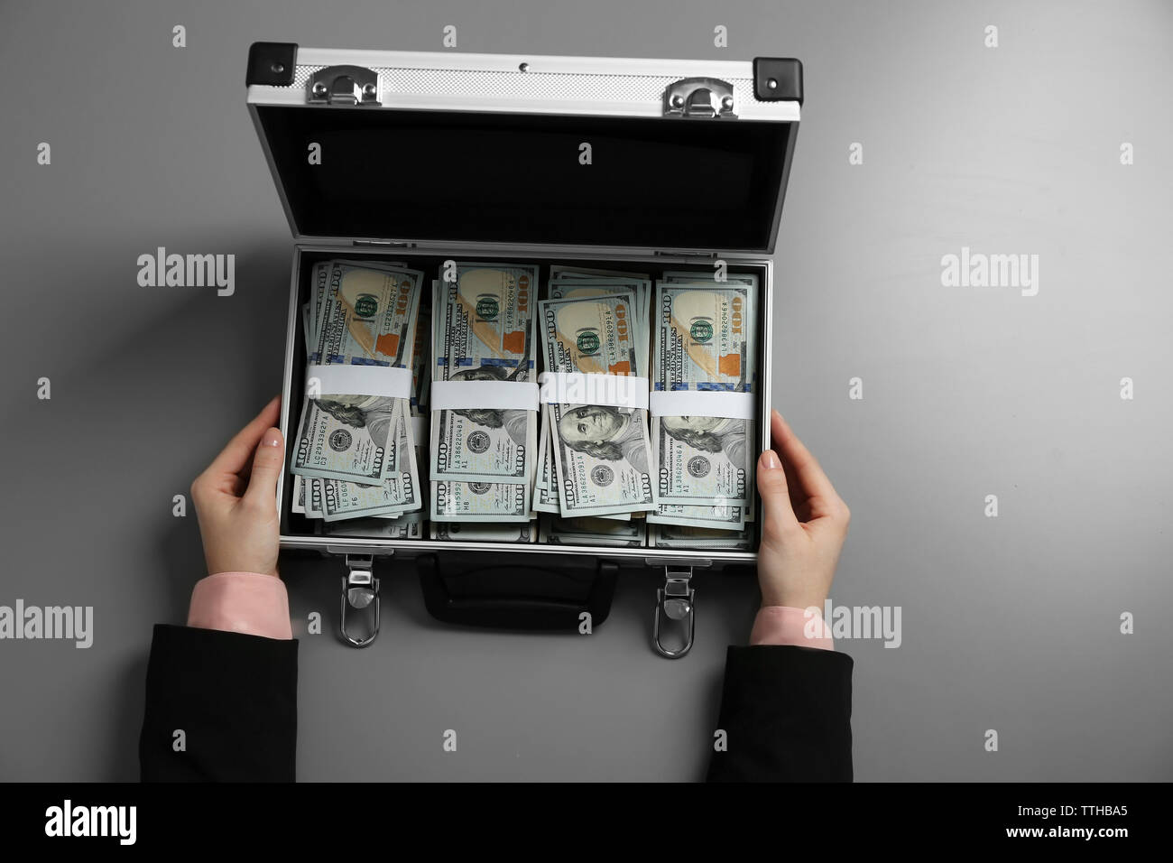 Case full of money hi-res stock photography and images - Alamy