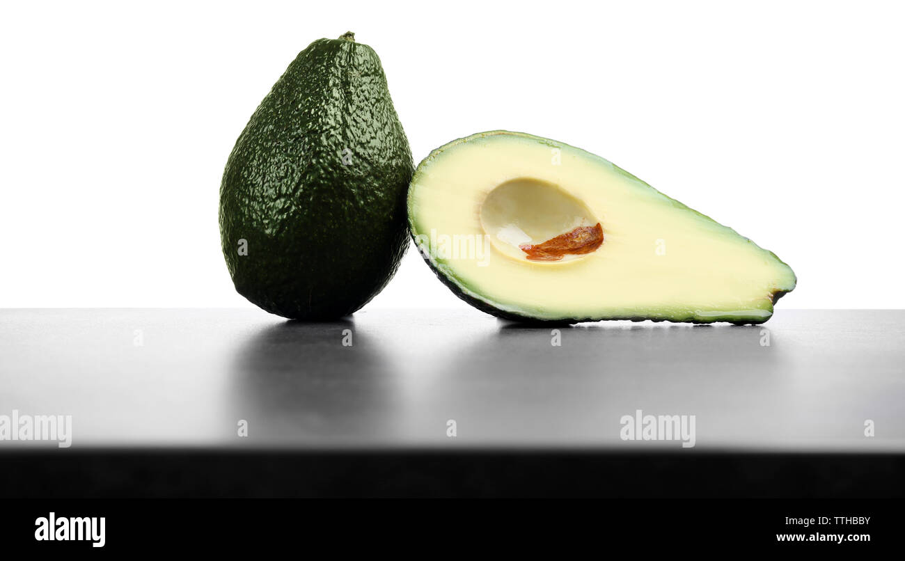 Fresh avocados on a white background Stock Photo - Alamy