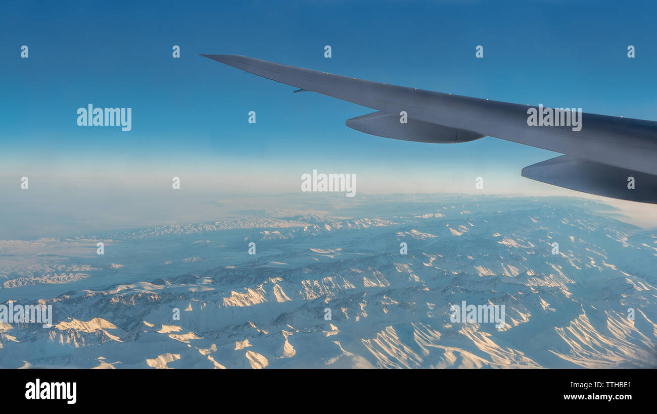 Traveling by air. Wonderful view of the Tian Shan snow mountains and ...