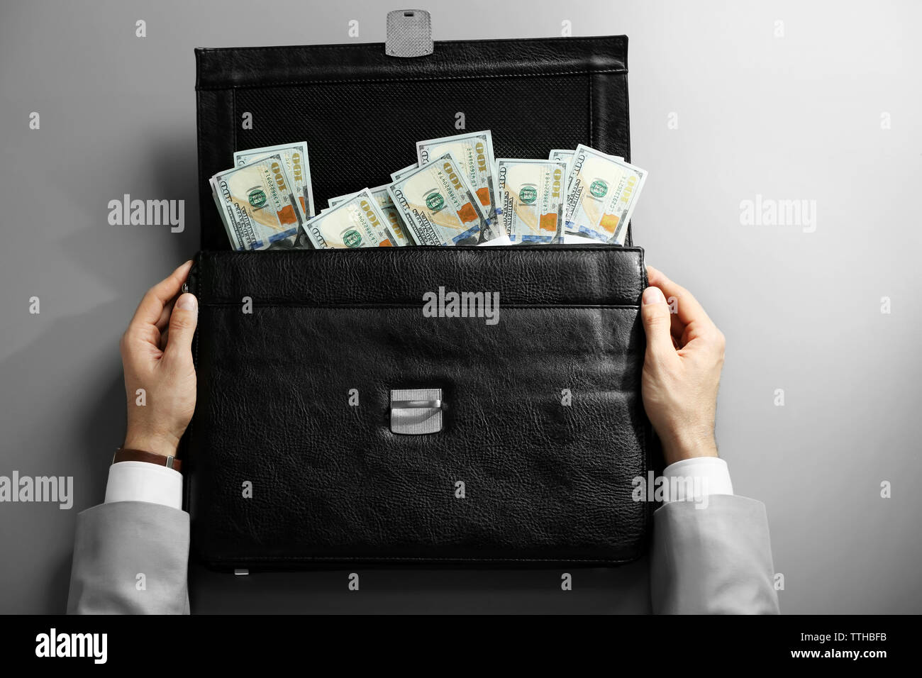 Brief case of money hi-res stock photography and images - Alamy