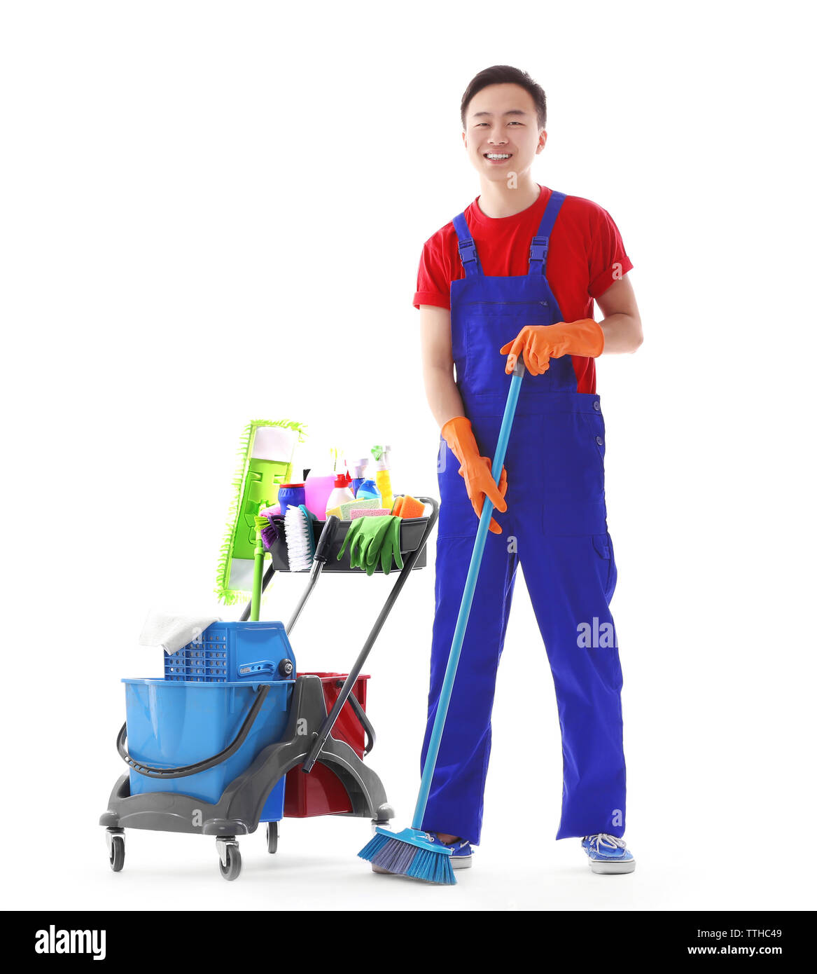 Young smiling male cleaner isolated on white Stock Photo - Alamy