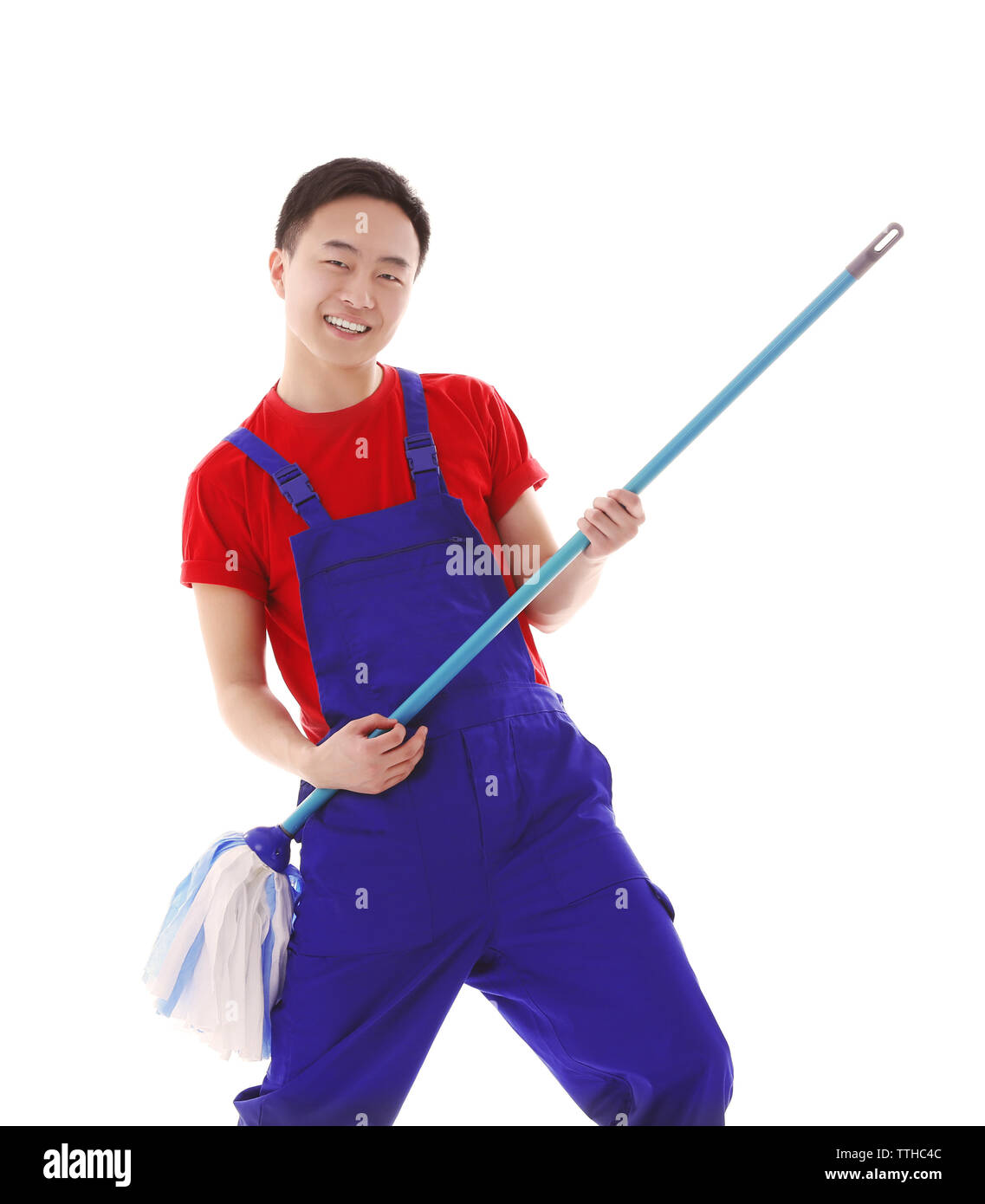 Young smiling male cleaner isolated on white Stock Photo - Alamy