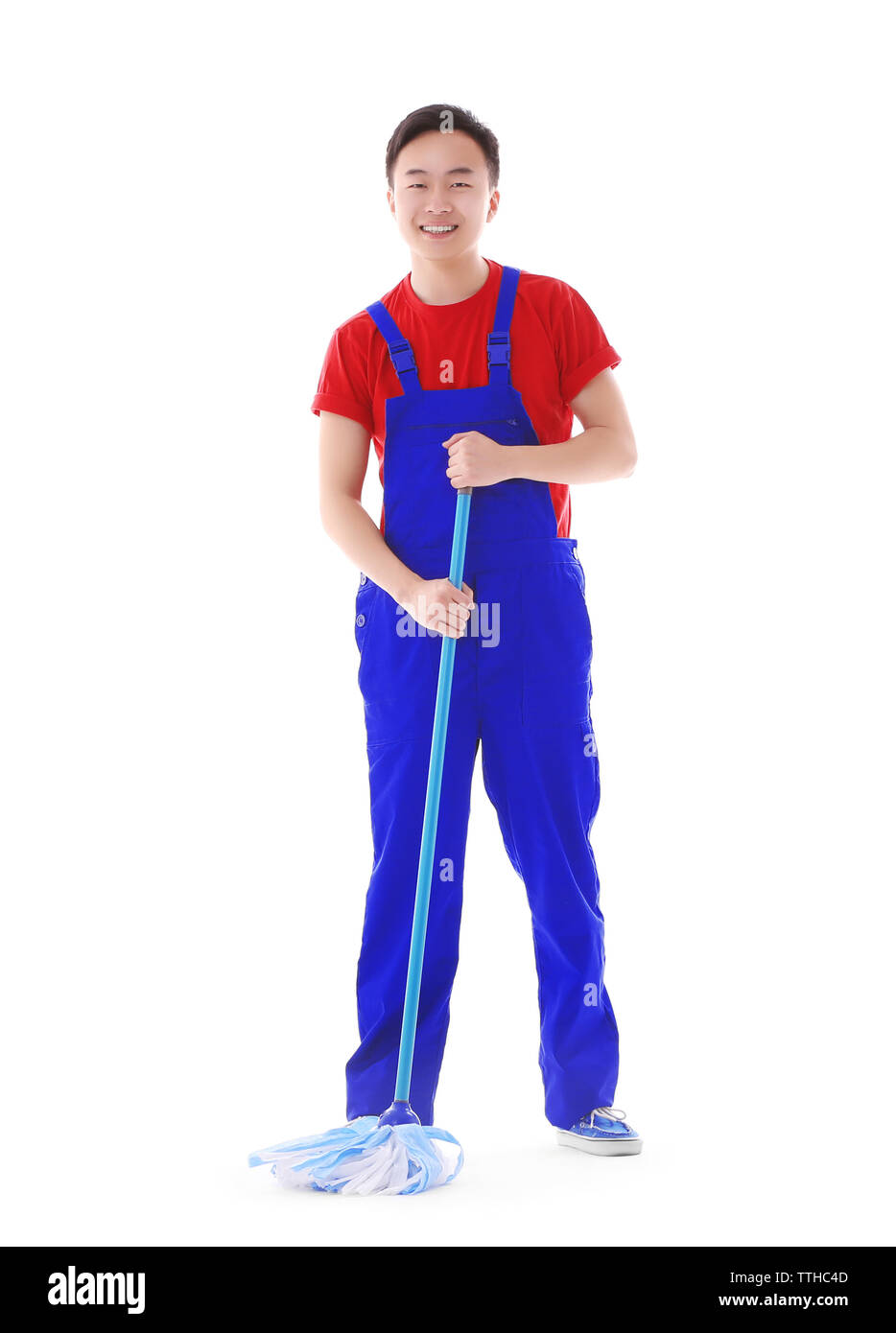 Young smiling male cleaner isolated on white Stock Photo - Alamy