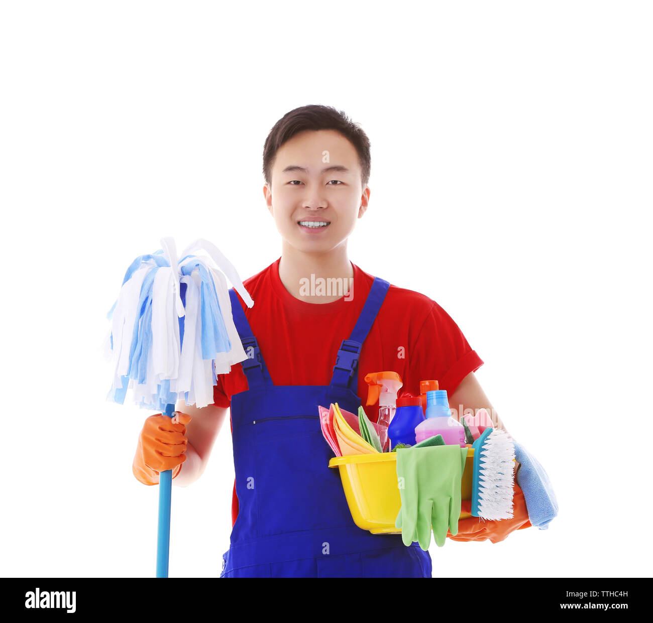 Young smiling male cleaner isolated on white Stock Photo - Alamy