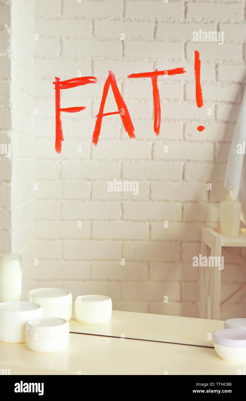 Word FAT written on mirror in the bathroom Stock Photo - Alamy