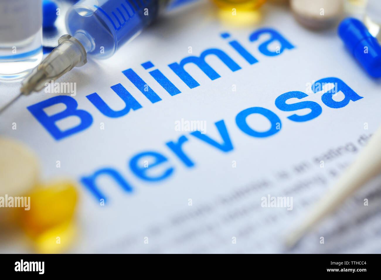Medicines and Bulimia diagnosis written on paper closeup Stock Photo ...