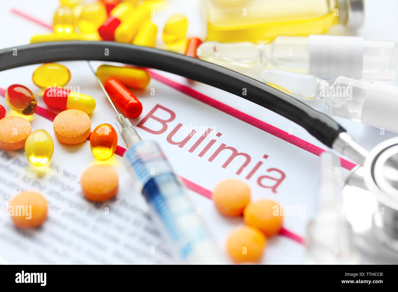Medicines and Bulimia diagnosis written on paper closeup Stock Photo ...