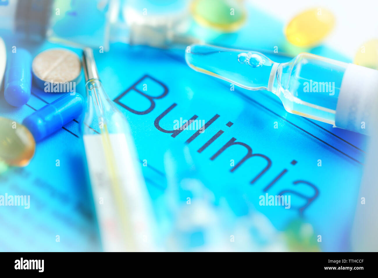 Medicines and Bulimia diagnosis written on paper closeup Stock Photo ...