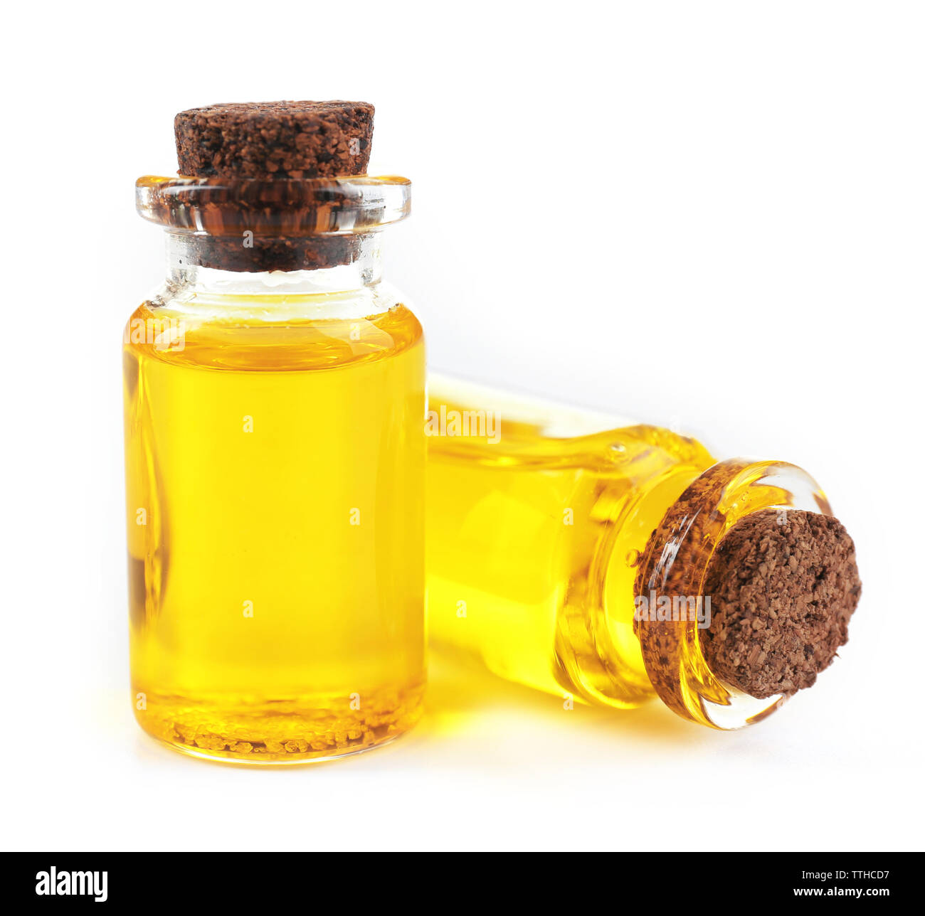 Bottles of tea oil, isolated on white Stock Photo - Alamy