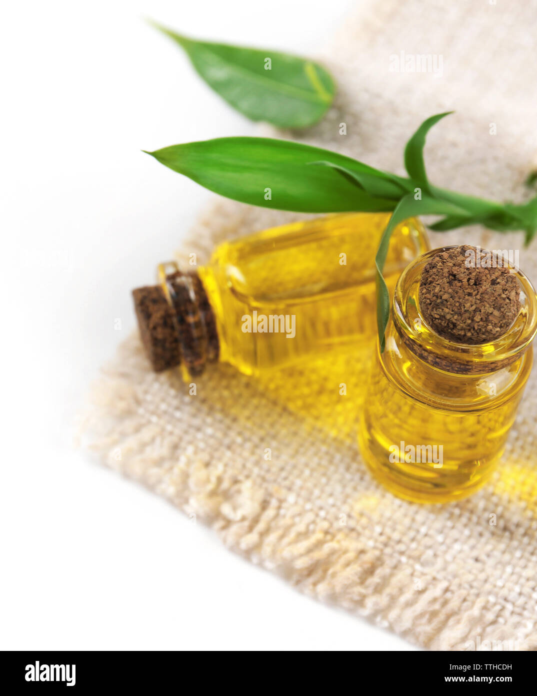 Bottles of tea oil, isolated on white Stock Photo - Alamy