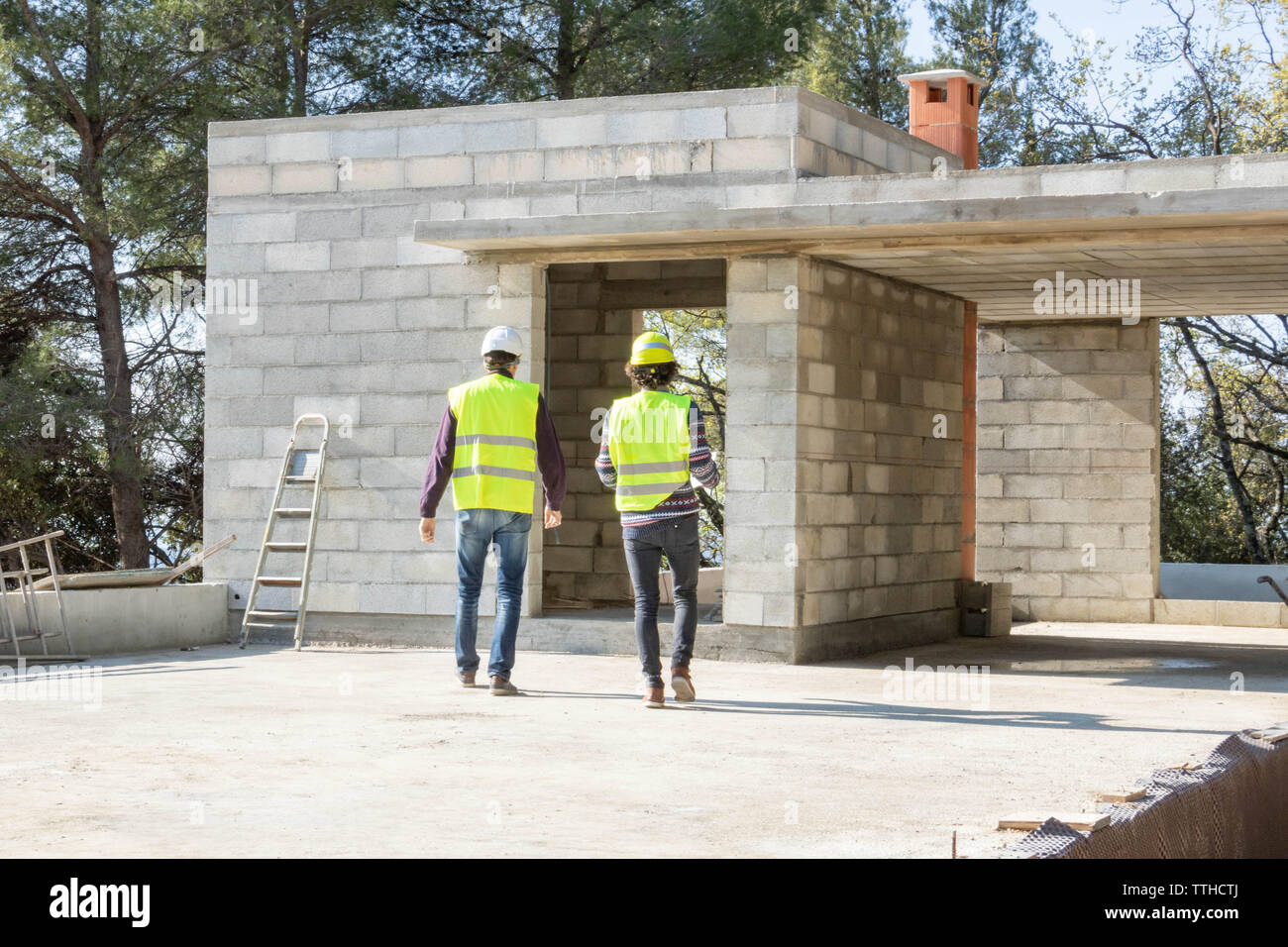 Client / Owner visiting the site of his future house under construction ...