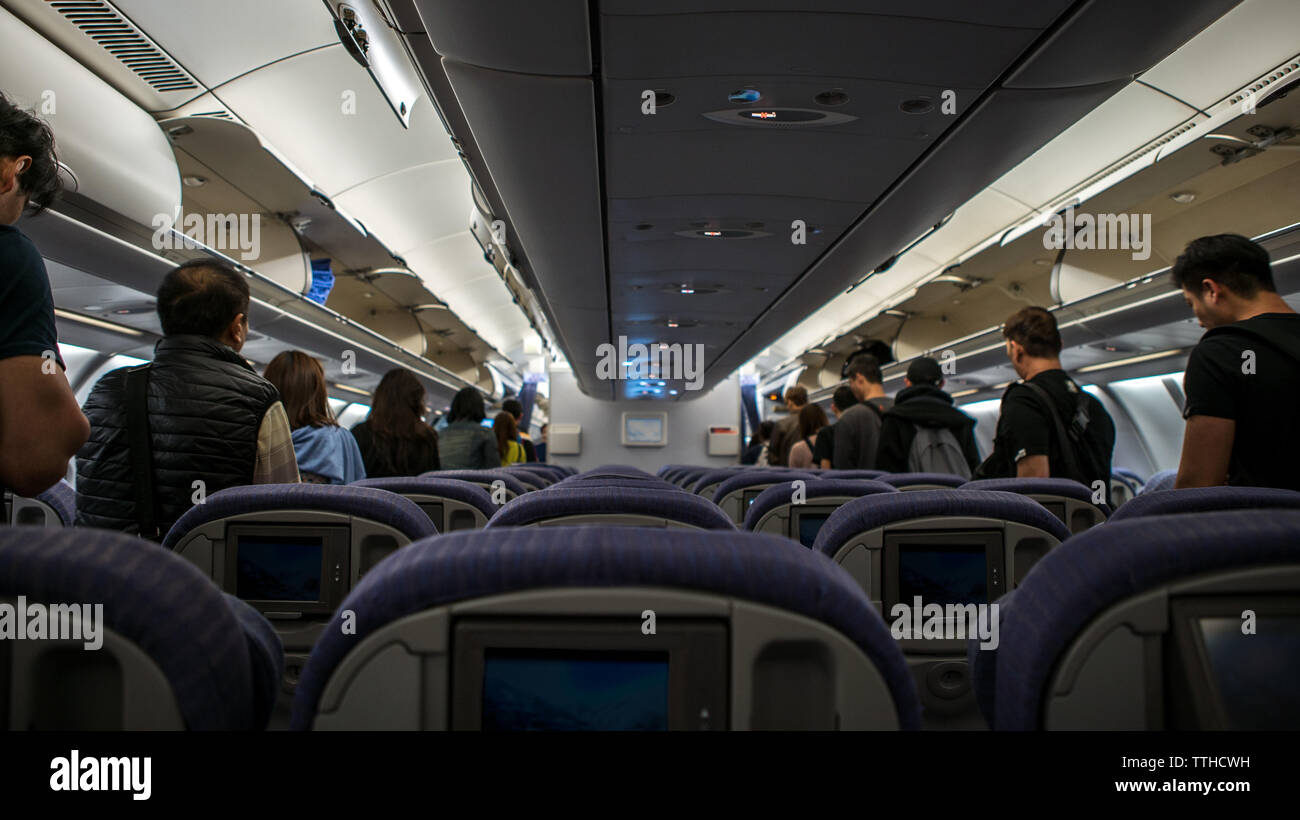 Plane Aisle Passenger Stock Photos & Plane Aisle Passenger Stock Images ...