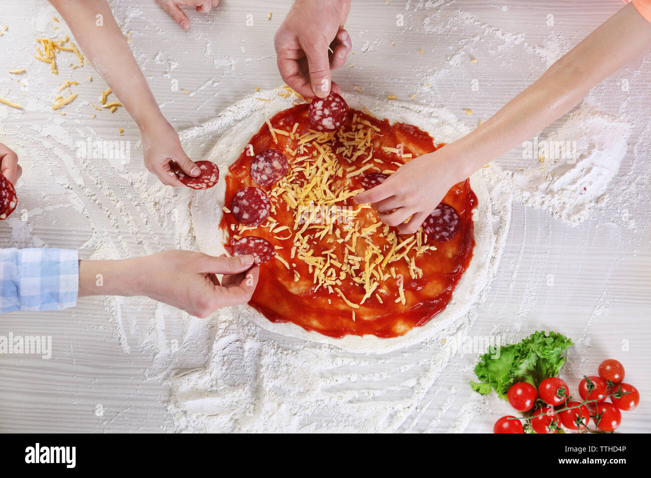 Family hands making a pizza , top view Stock Photo - Alamy