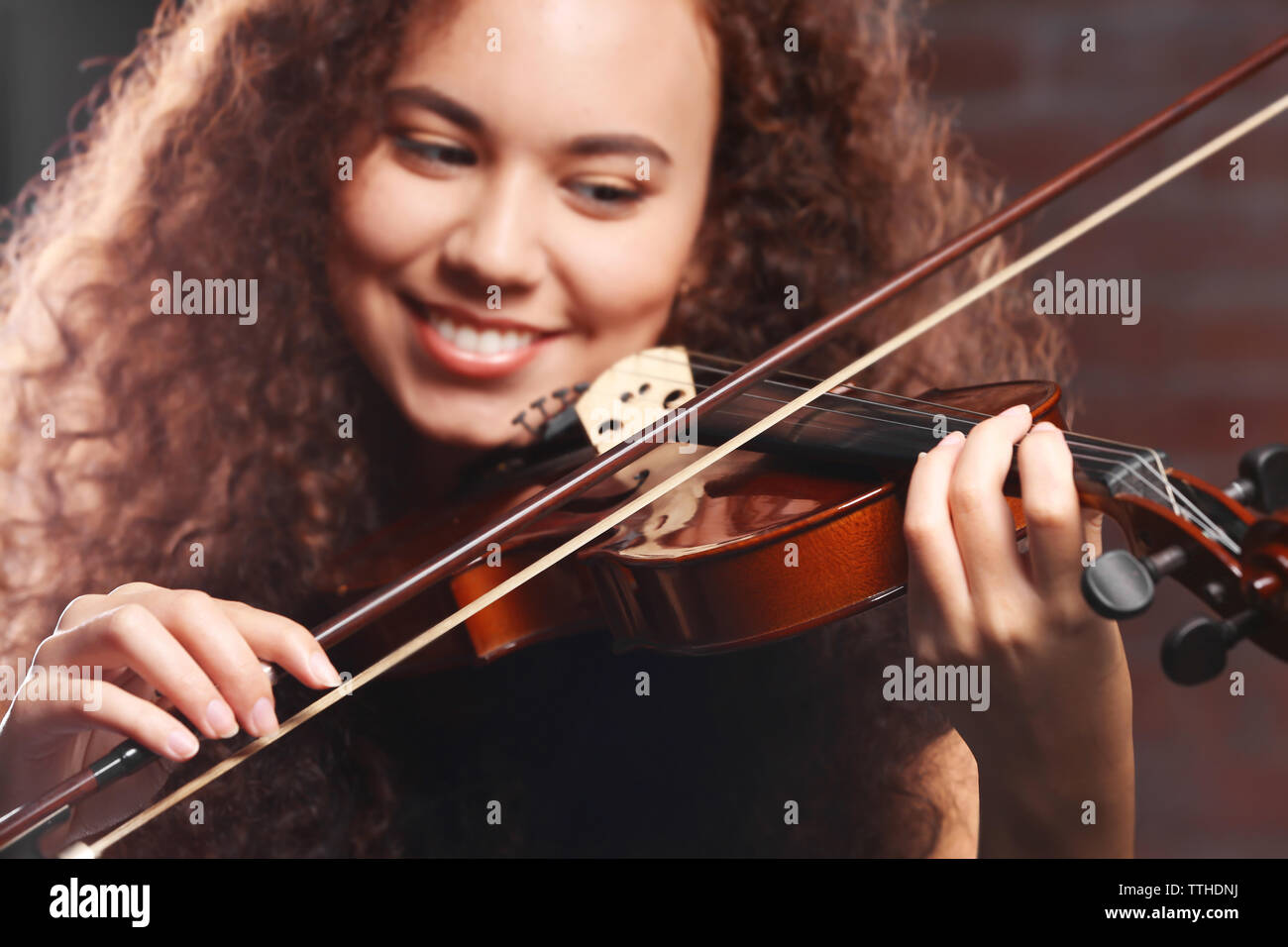 Beautiful young woman playing violin hi-res stock photography and ...