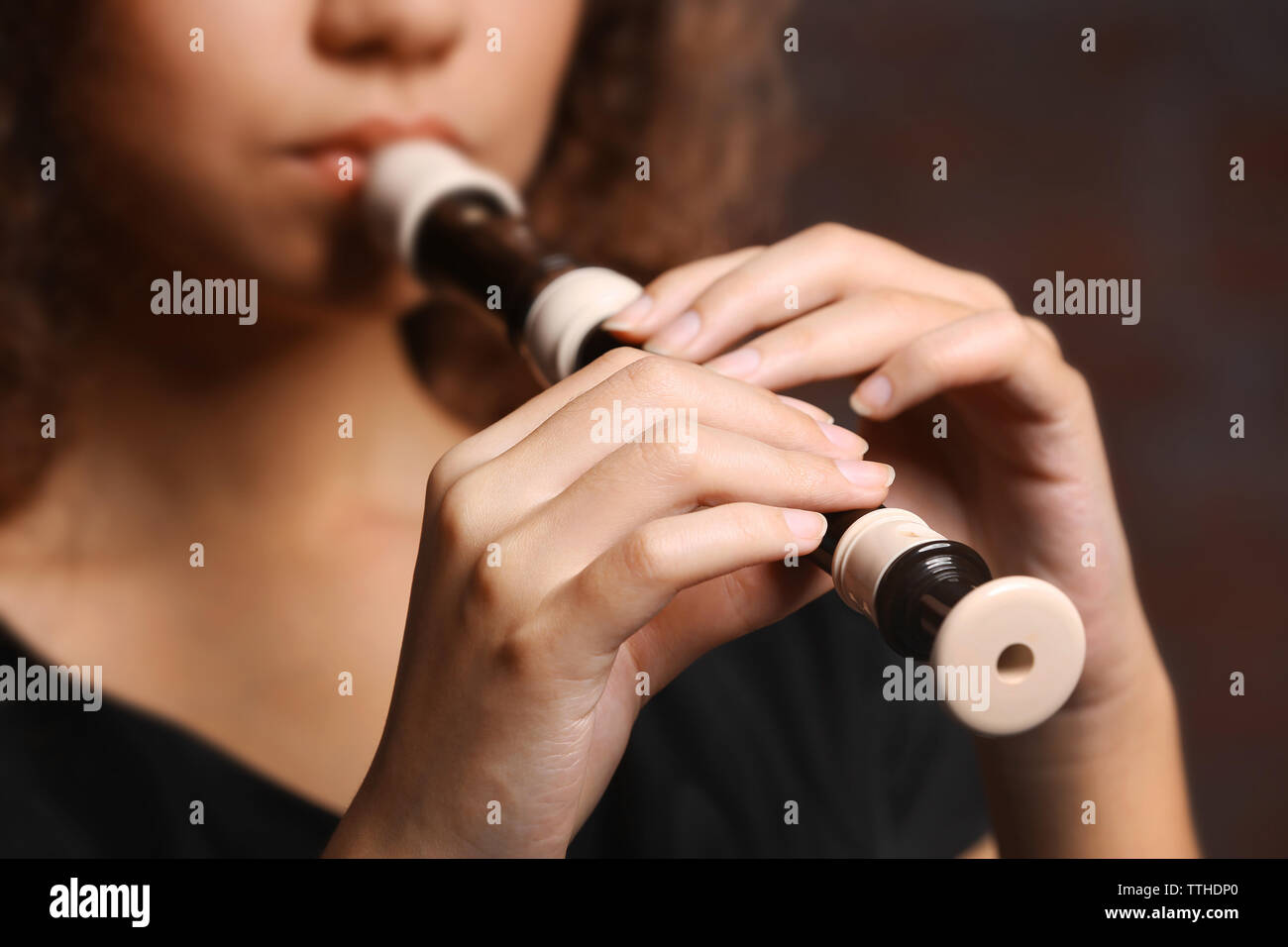 Young woman playing recorder hi-res stock photography and images - Alamy