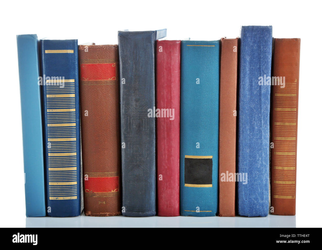 Books positioned in a line isolated on white Stock Photo - Alamy