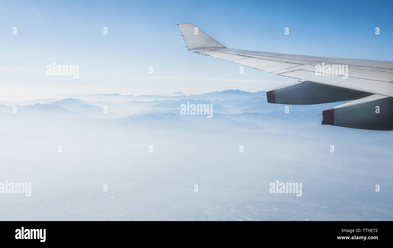 Aerial view of Taiwan Mountains with airplane wing, as seen through ...