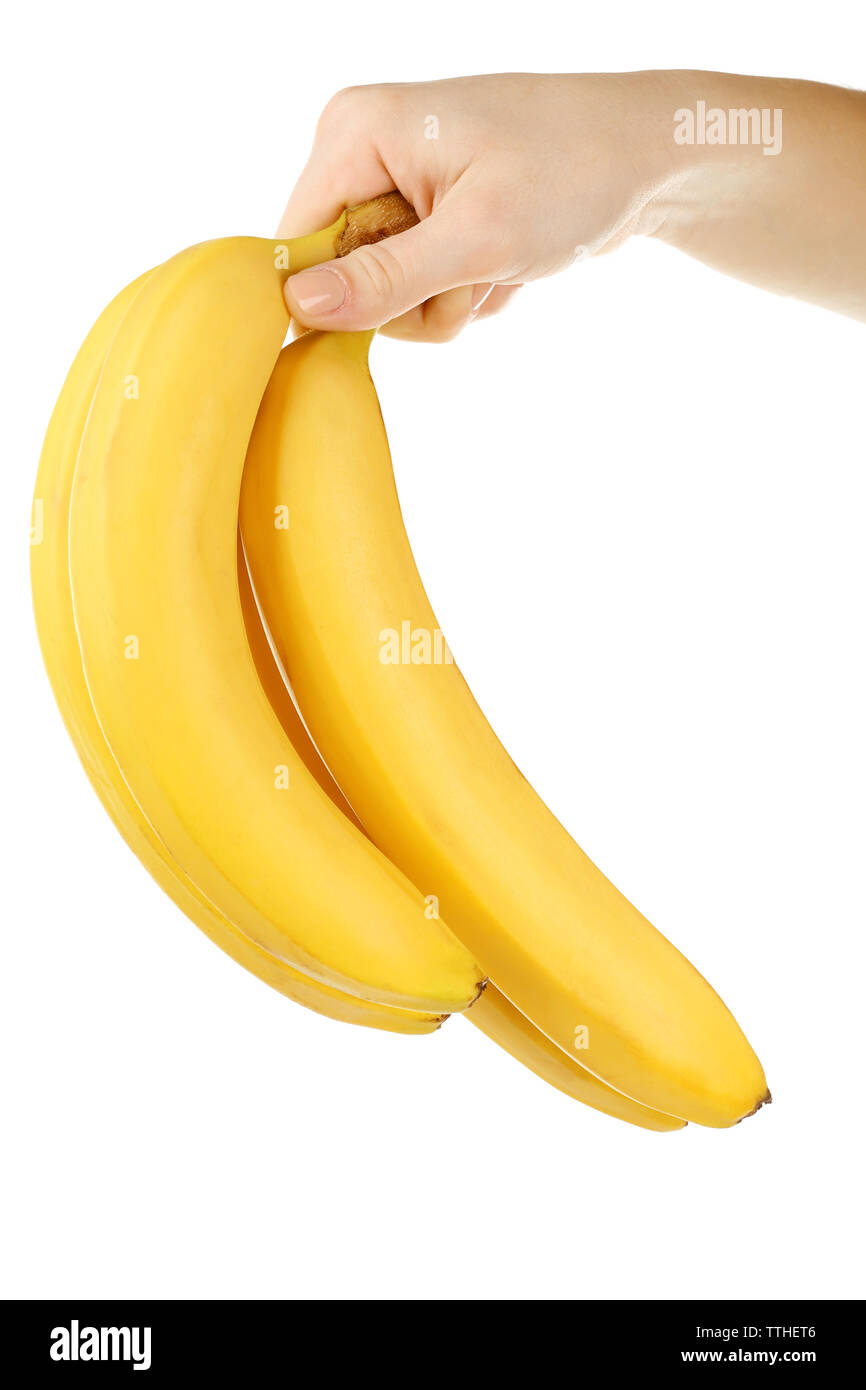 Female hand holding bananas isolated on white Stock Photo - Alamy