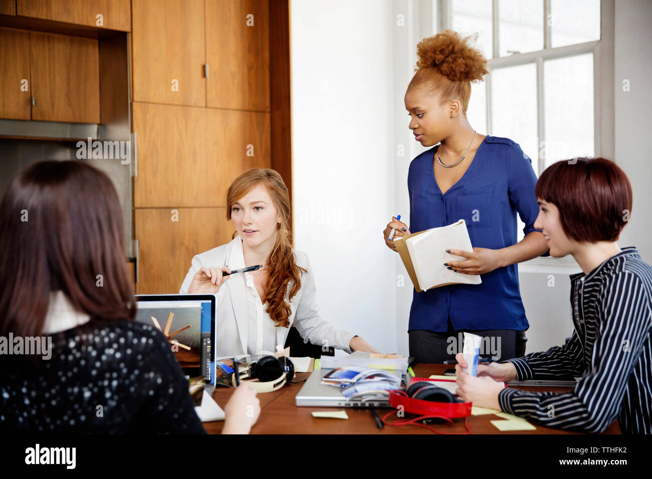Millennial creative business colleagues brainstorming hi-res stock ...