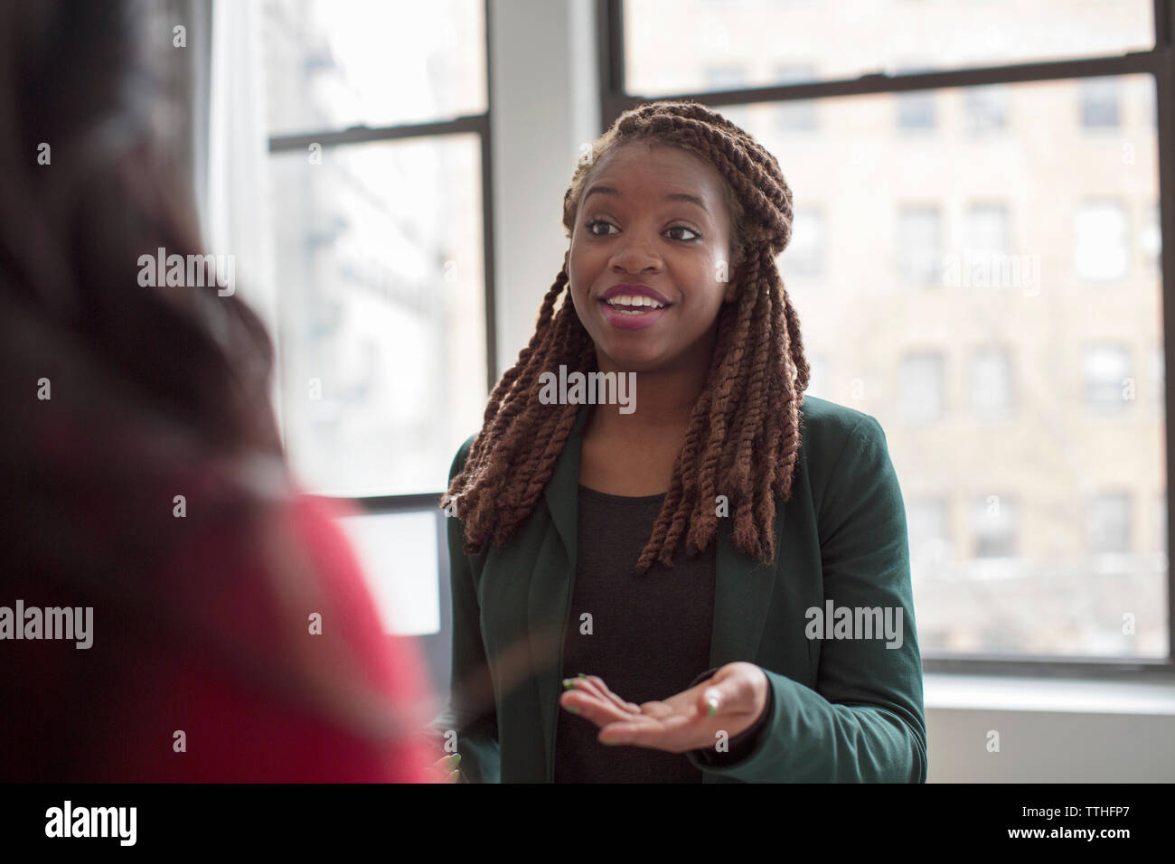 Office workers talking standing up hi-res stock photography and images ...