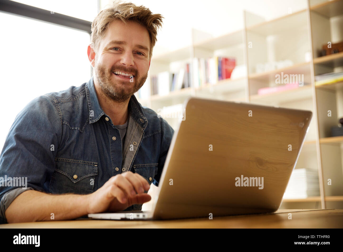 Portrait happy man laptop hi-res stock photography and images - Alamy