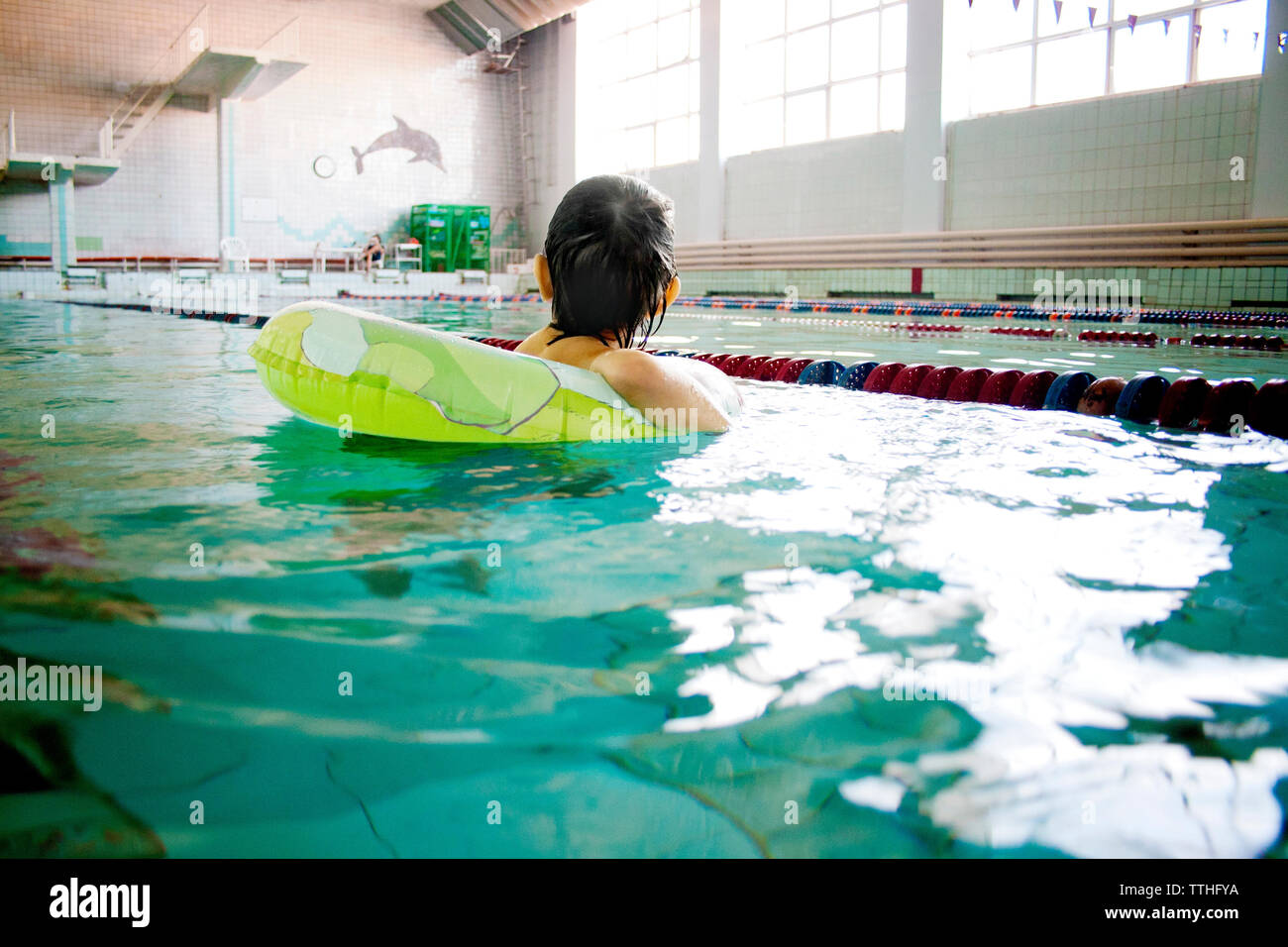 Boy with inflatable ring swimming in pool Stock Photo - Alamy