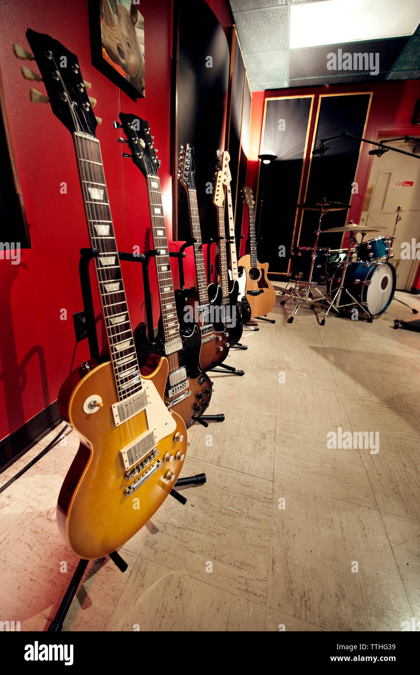 Guitars in music studio Stock Photo - Alamy