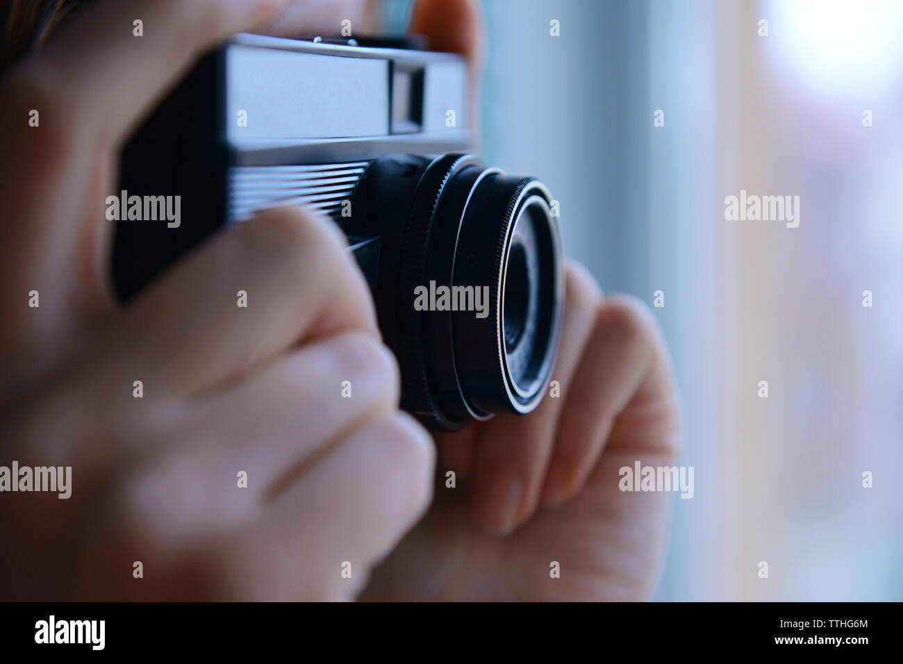 Female hands holding retro camera closeup Stock Photo - Alamy