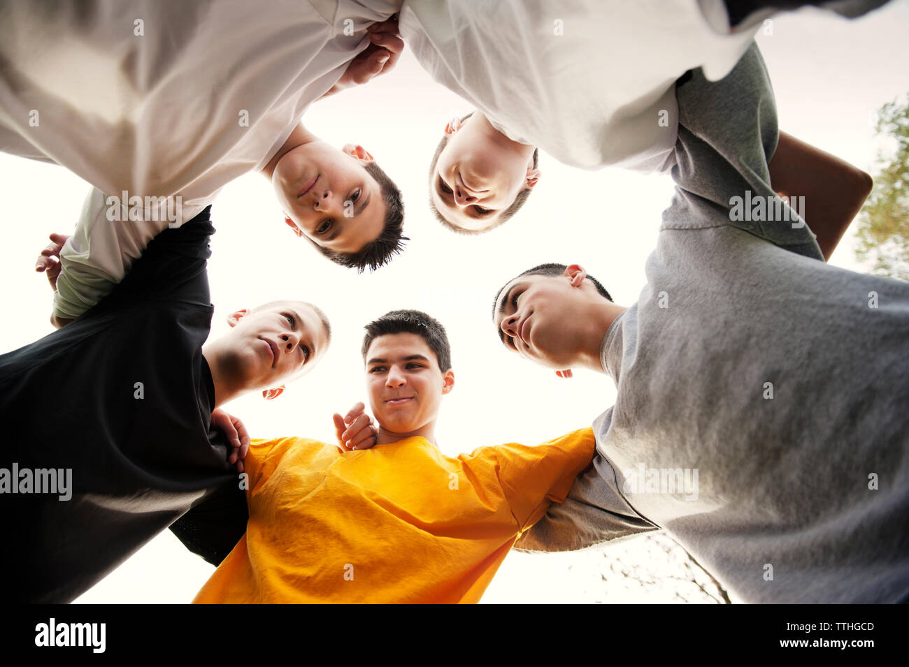 Directly below shot of team forming huddle in match Stock Photo - Alamy