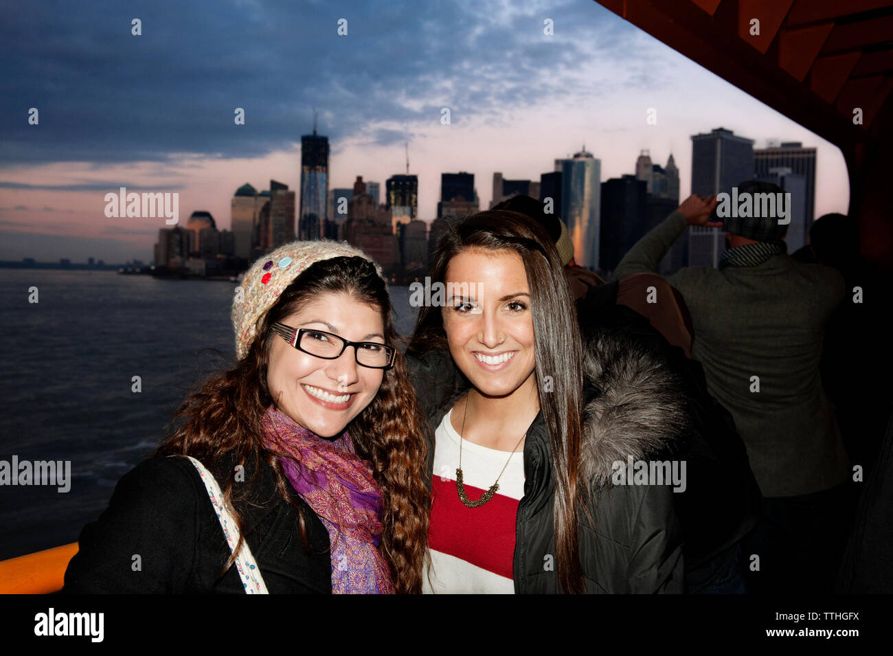 Portrait of happy friends standing in passenger ship Stock Photo - Alamy