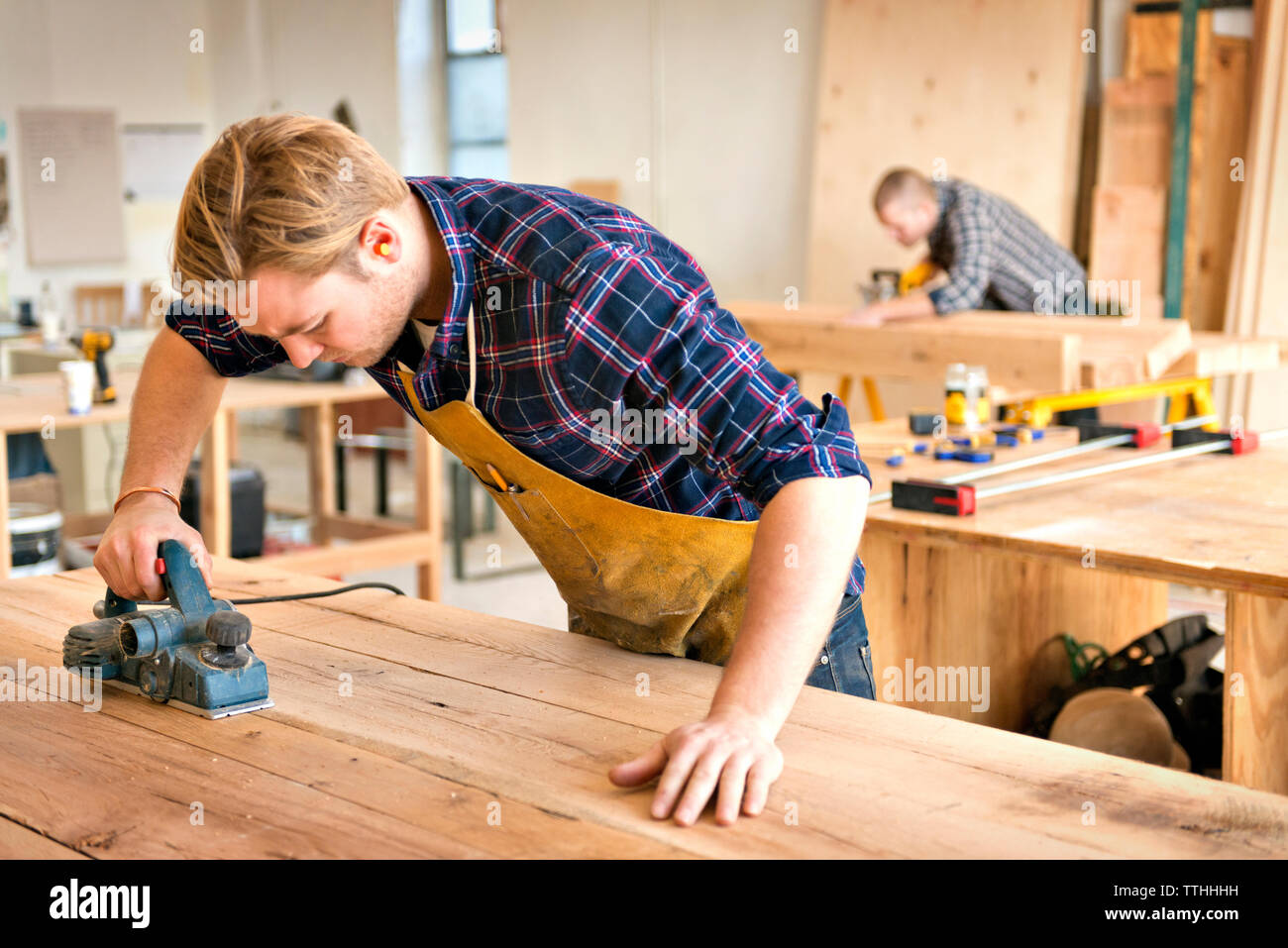 Holding standing looking down work tool skill hi-res stock photography ...