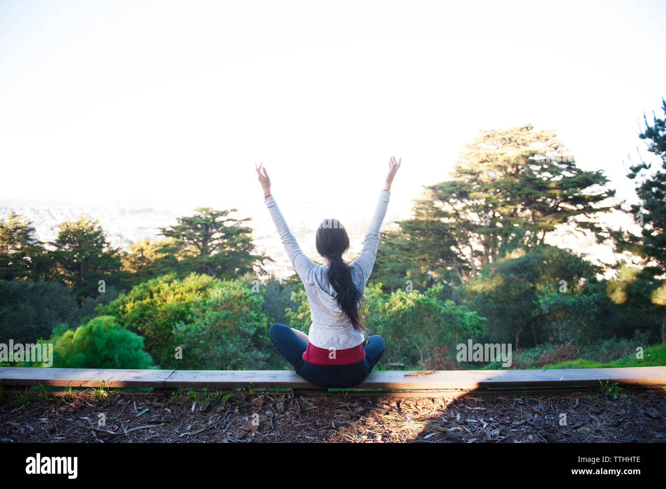 Woman arms raised rear view sky hi-res stock photography and images - Alamy